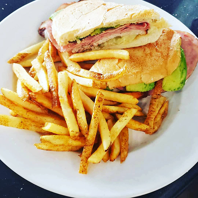 Ladies and gentlemen, meet the star of our show – the Cubano! This sandwich isn't just pressed; it's been smooth-talked into delicious submission.