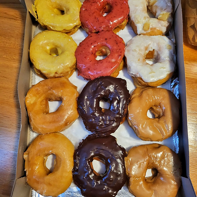 A rainbow of glazed perfection&mdash;from classic chocolate to vibrant strawberry, each donut promises its own sweet adventure.