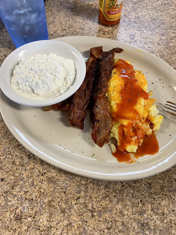 Eggs so perfectly cooked, they'd make Gordon Ramsay weep with joy. Paired with bacon crispier than your grandpa's jokes, it's a breakfast match made in heaven. Photo credit: David H.