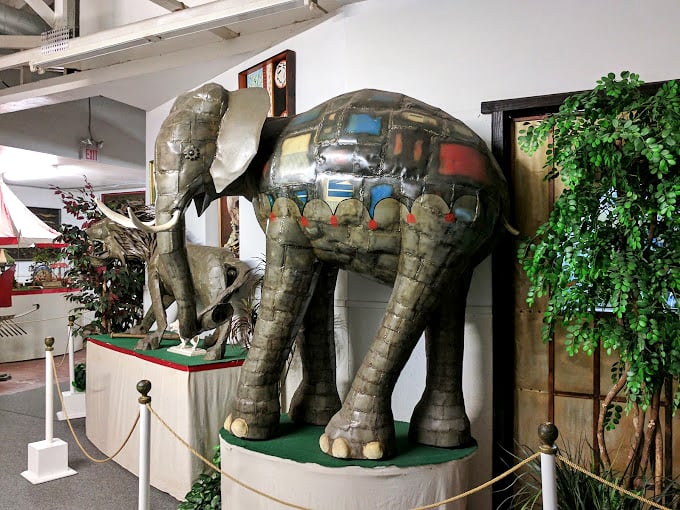 This metallic pachyderm proves that even elephants can get dressed up, sporting a patchwork of recycled materials that would make any junkyard proud.