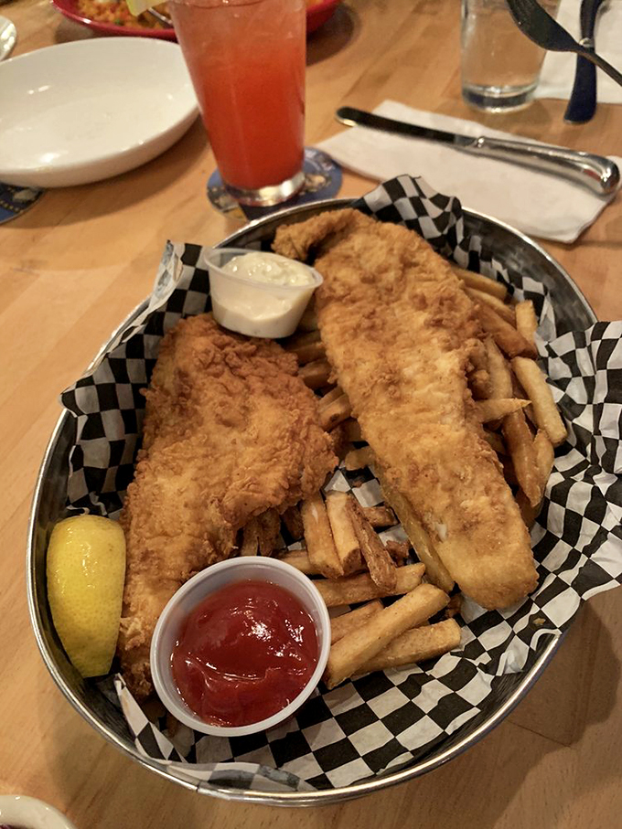 A dynamic duo that would make Batman and Robin jealous. Crispy fish, golden fries, and a refreshing vodka lemonade – it's summer on a plate (and in a glass).