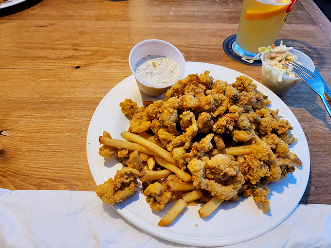Golden-fried clams piled high with crispy fries &ndash; a plate that would make Neptune himself abandon his trident for a fork. Photo credit: david stempler