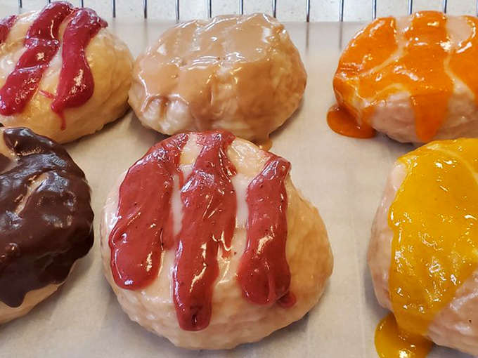 A striped parade of fruity glazes marching across classic donuts &ndash; it's like tie-dye met breakfast and fell in love.