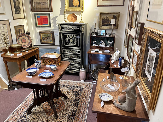 A carefully curated corner showcases fine furniture and decorative arts, from ornate cabinets to delicate blue-and-white porcelain.