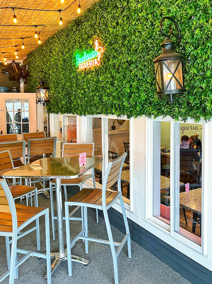 Green walls and golden lights create an enchanted forest vibe that makes every taco feel like a special occasion.