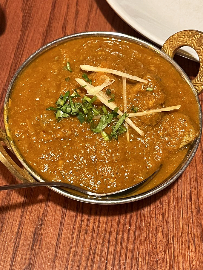 This isn't just curry &ndash; it's a rich, aromatic masterpiece that makes you wonder why you ever settled for basic stew. Photo credit: Tom F.