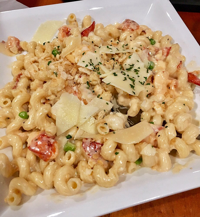 Every forkful tells a story: chunks of sweet lobster meat nestled among perfectly cooked pasta, crowned with fresh herbs.