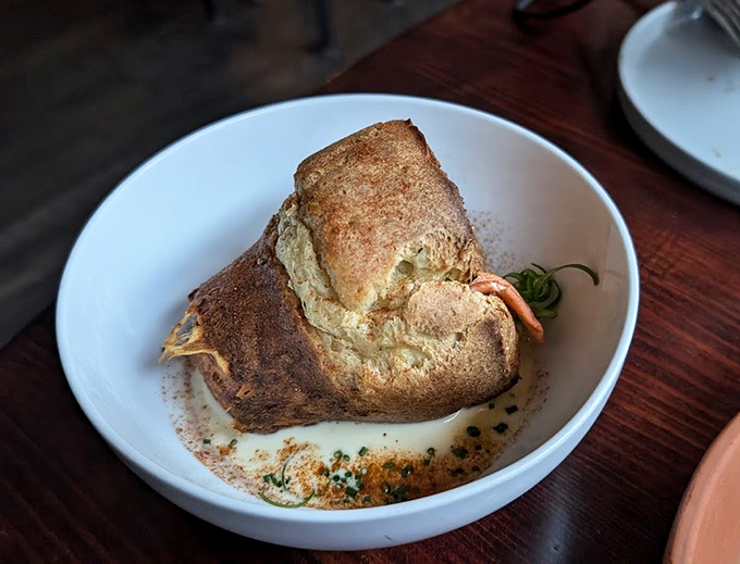 This lobster roll isn't just a sandwich, it's a Maine event! Golden fries and a perfect lemon wedge complete the coastal classic.