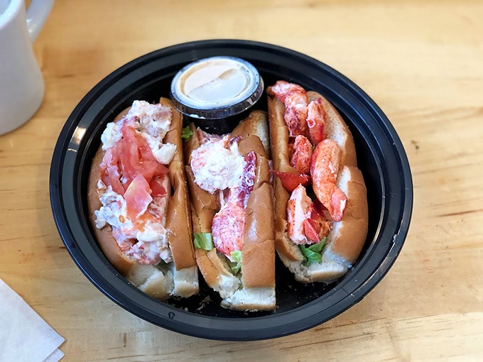 Three's company! A trio of perfectly dressed lobster rolls shows why people line up around the block at Alisson's. Photo credit: Danny Chong