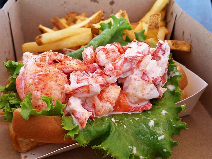 The dynamic duo of the seafood world: a lobster roll that's more stuffed than your holiday turkey, paired with fries crispier than New England fall leaves.