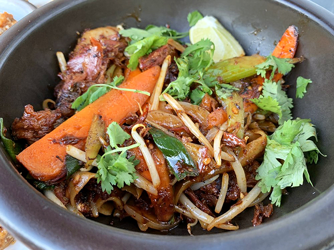 Stir-fried noodles with tender meat and crisp vegetables dance together in a savory symphony that would make any wok master proud. Photo credit: Lulu L.