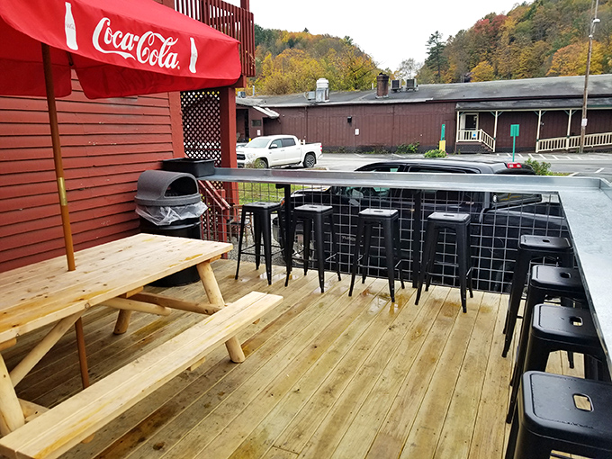 The outdoor deck offers fresh mountain air with your meal, complete with classic picnic tables and a view worth savoring.