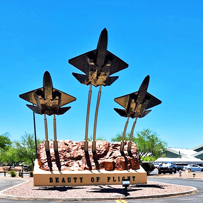 Three generations of military aircraft stand guard, showcasing the evolution of aerial prowess from propellers to jet engines.