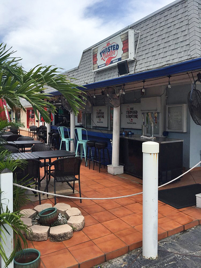 The covered patio offers a breezy retreat where cold drinks and seafood dreams come together under Florida skies.