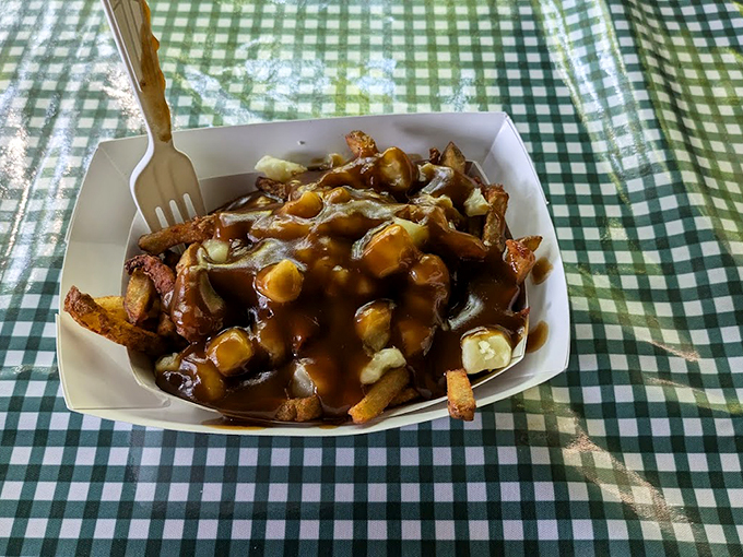 Golden fries swimming in gravy and cheese curds - a Canadian classic that found its way south and made itself at home.