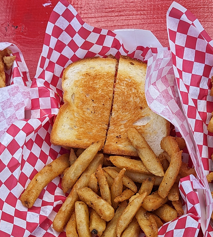 Golden toasted bread barely containing the delicious chaos inside, this Reuben with its side of perfectly seasoned fries represents everything right about casual summer dining in New England.