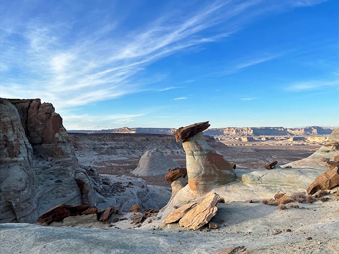 Nature's balancing act: Wind-carved hoodoos stand sentinel over the vast desert landscape like abstract chess pieces.