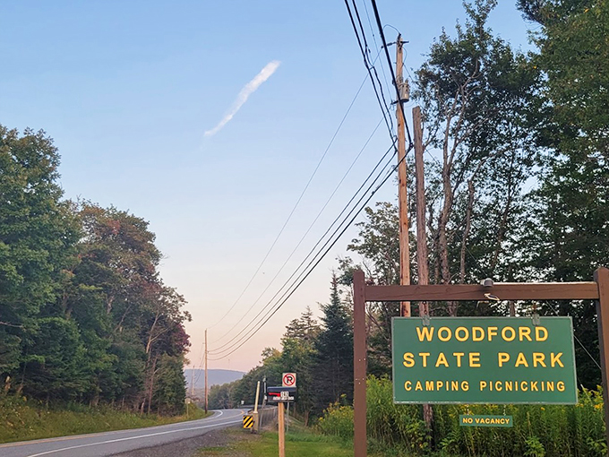 Welcome to Woodford State Park, where even the entrance sign knows how to frame a perfect sunset moment.