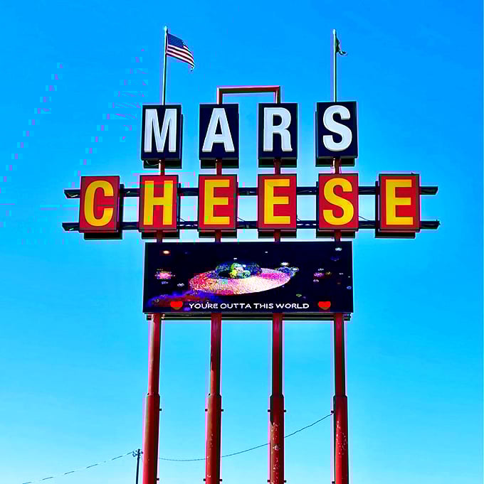 The sign says it all - you're about to enter a world that's truly out of this world. Prepare for liftoff, cheese astronauts! 