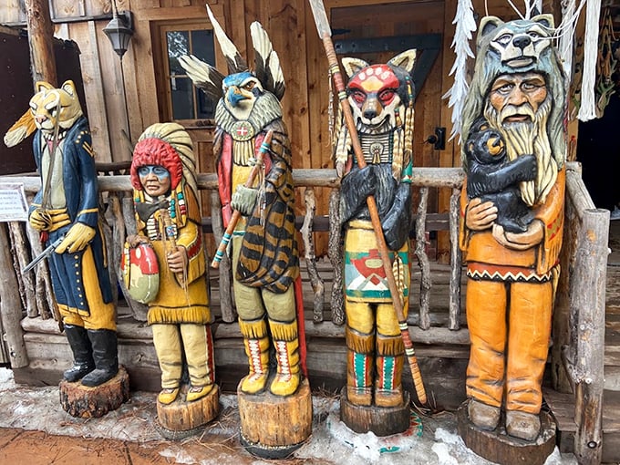 The world's quirkiest welcoming committee. These wooden guardians are like the Avengers of the forest, if the Avengers were, well, wooden.