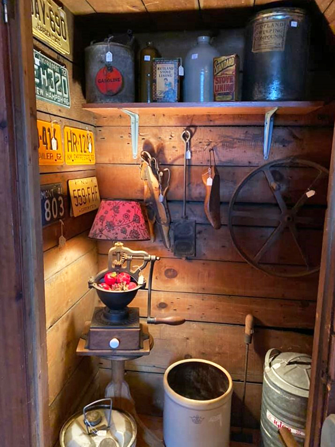 Behold, the garage sale of your dreams! This nook is packed tighter than a hipster's beard with license plates, antique cans, and forgotten farm tools.