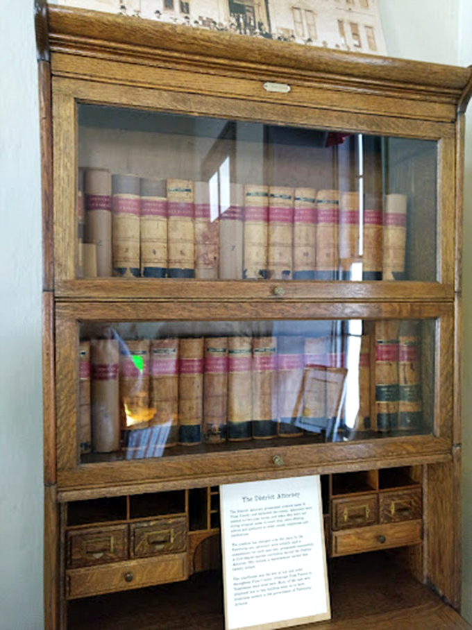 Law books from territorial days line these original wooden shelves, each volume holding secrets of Arizona's early legal system.
