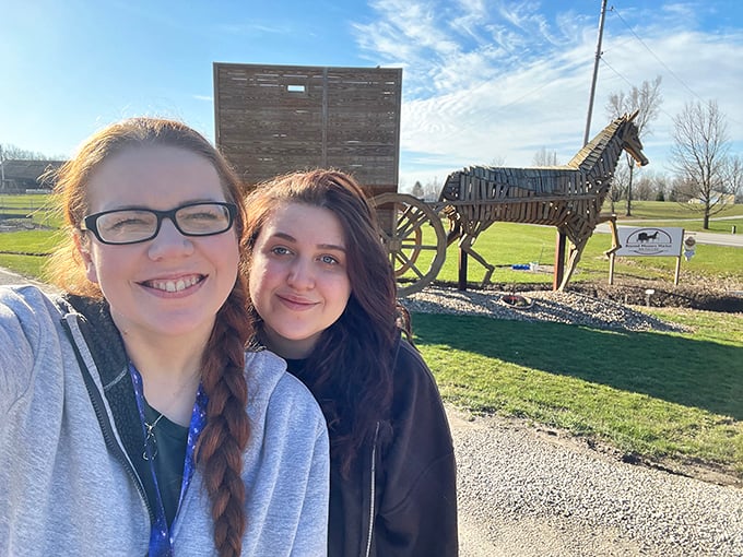 "I swear it looked smaller online!" Visitors get a true sense of scale next to this towering tribute to traditional transportation.