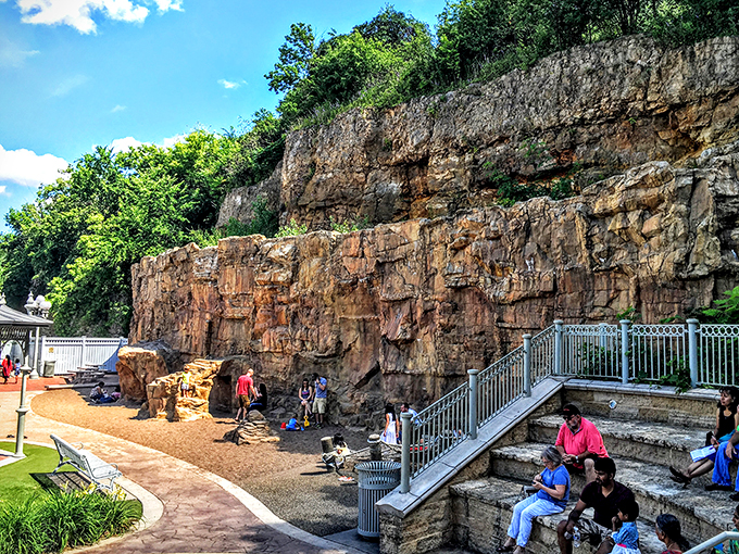 Nature's amphitheater meets playground paradise. This rocky backdrop sets the stage for countless adventures, with comfy seating for parents to enjoy the show.