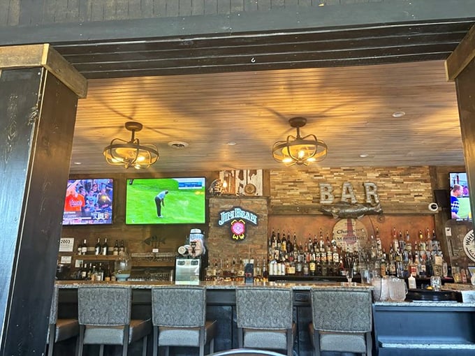 Where sports meets spirits - the warm glow of vintage-style lighting illuminates a well-stocked bar that beckons after a day on the lake.