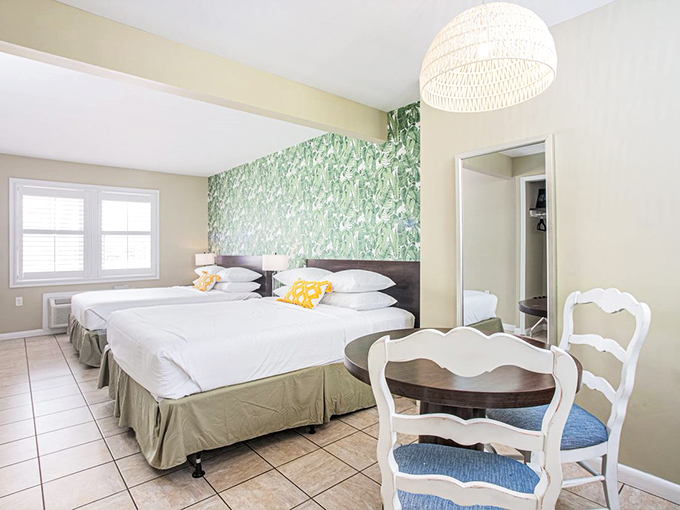 Dreamy green wallpaper and crisp white linens &ndash; it's like sleeping in a mojito, minus the hangover.