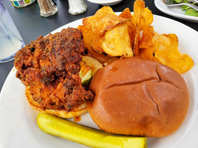 Clucking delicious! This crispy chicken sandwich is giving Colonel Sanders a run for his money, with a side of golden potato chips to boot.