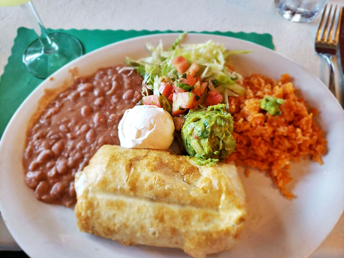 Golden-brown perfection meets comfort food bliss - this chimichanga comes dressed to impress with all the classic fixings.