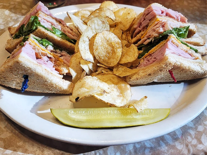 The Leaning Tower of Deliciousness! This club sandwich is stacked higher than your grandpa's tales of walking to school uphill both ways.