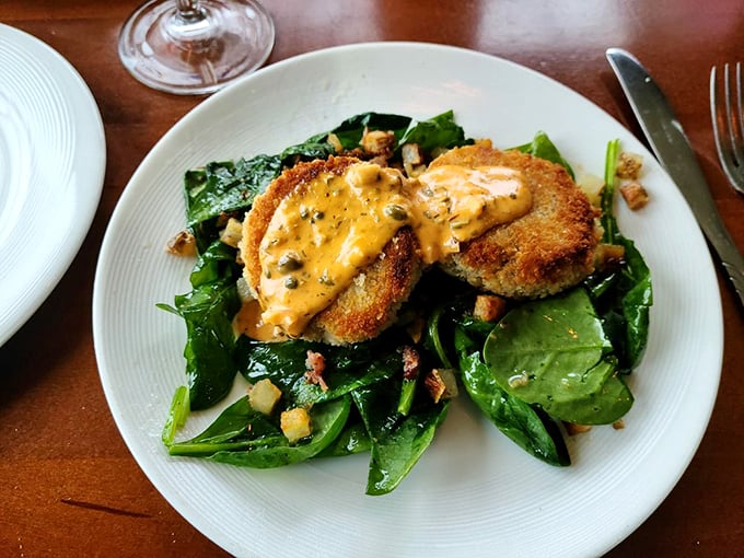 Crab cakes so golden, they'd make King Midas jealous! Perched atop a bed of greens, they're the crown jewels of the seafood world.