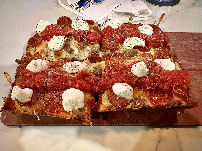 Behold the Detroit-style pizza in all its glory! It's not a pizza, it's an edible work of art.