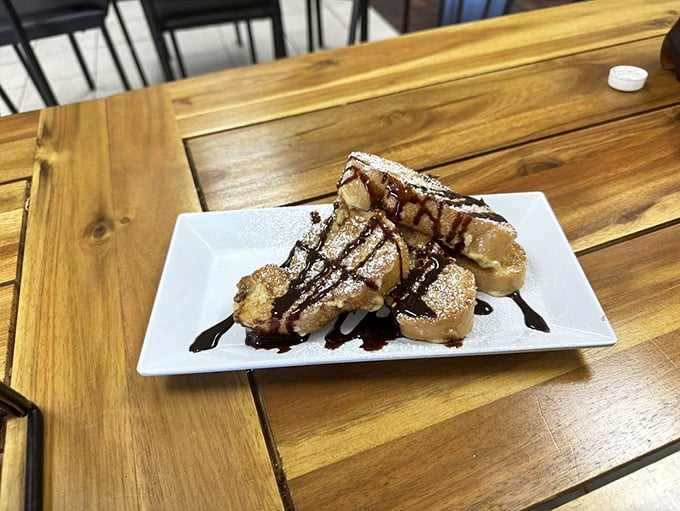 French toast or edible art? This plate is sweeter than a retiree's goodbye to winter, drizzled with enough chocolate to make Willy Wonka jealous. Photo credit: Shawn L.