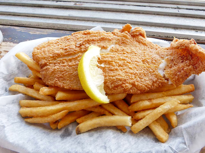 Another angle of fish and chip heaven – notice how the light catches that perfect golden crust? That's not an accident, folks.