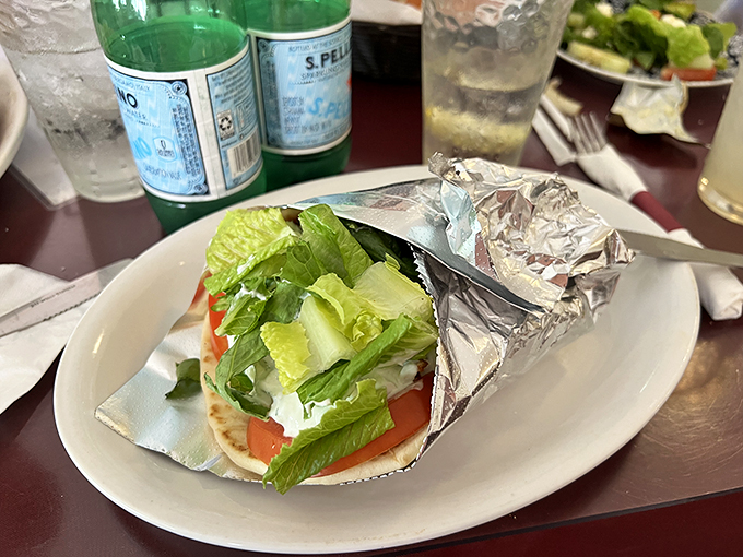 Who knew heaven could be wrapped in foil? This gyro is ready to take your taste buds on a Grecian getaway, no passport required. Photo credit: Denis Ivashyna