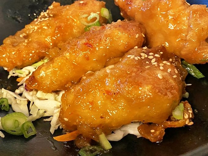 Orange chicken that puts mall food courts to shame. It's like General Tso went to culinary school and came back with a PhD.