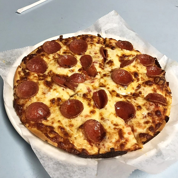 Cheese pulls for days! This pizza doesn't just satisfy hunger, it puts on a show. It's the Cirque du Soleil of the culinary world.