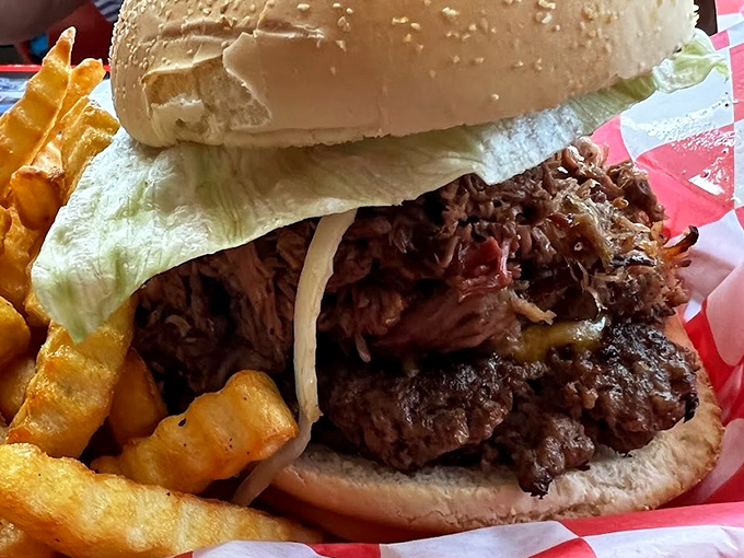 Pulled pork perfection! This sandwich is piled so high, you might need to unhinge your jaw like a snake.