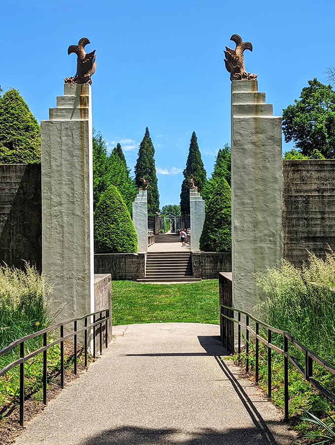 Grand entrance or portal to Narnia? These pillars are itching to tell tales of garden parties past. Photo credit: Tamra Parker