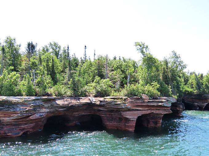 Lake Superior's island paradise! Azure waters and red sandstone cliffs create a landscape that rivals the Mediterranean.
