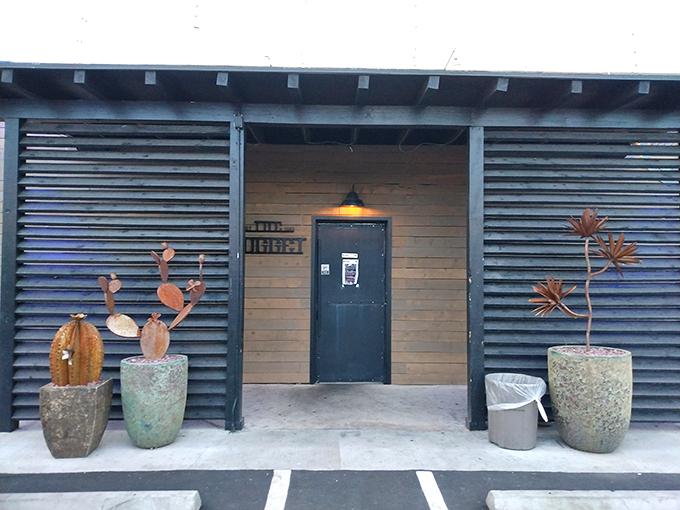 The Nugget's eclectic interior: Where Wild West meets "I'll hang anything on these walls." It's like your grandpa's attic, but with better drinks.