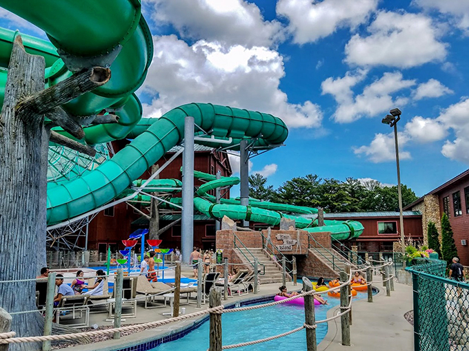 Massive slides snake through the air like prehistoric water creatures, promising thrilling descents for brave souls.