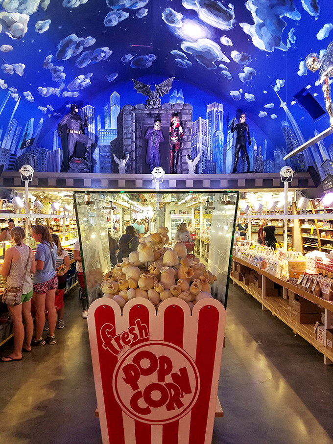 Holy kernels, Batman! This popcorn display is larger than life. It's like the snack decided to become the main attraction.