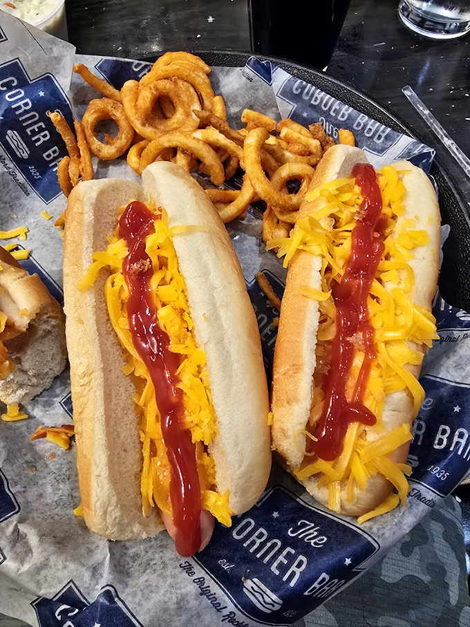 Cheese, please! These dogs are wearing their formal attire - a golden jacket of melted cheddar fit for royalty.