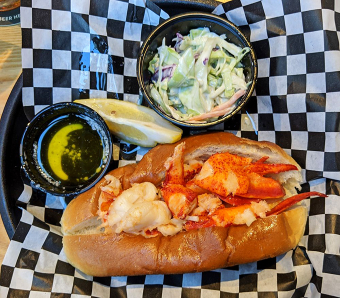 A symphony of flavors: succulent lobster, crisp coleslaw, and a hint of lemon. It's like a beach vacation for your taste buds, minus the sand in your shorts.