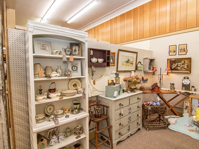 White shelving displays delicate china and collectibles, arranged with the precision of a museum curator's loving touch.