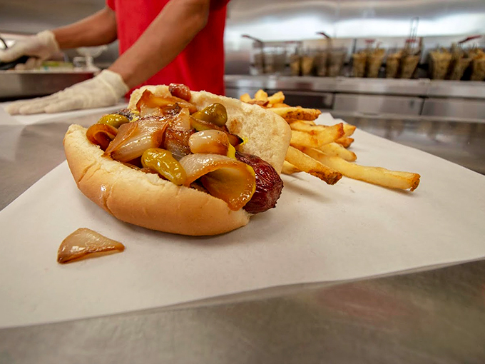 A hot dog dressed to impress, wearing the full Chicago ensemble&mdash;sport peppers, onions, and pickle spears in perfect harmony.